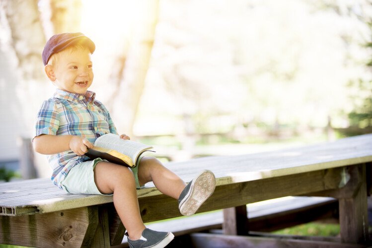Boy Reading Bible Smiling