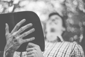 Man Reading Bible Under Tree