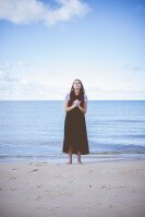 Woman Praying at Beach
