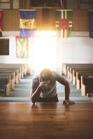 Man Praying at Altar