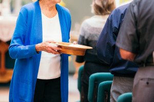 A Woman Collecting Tithe