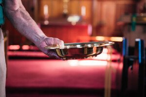 A Man Collecting A Tithe