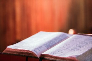 Open Bible With A Wood Background